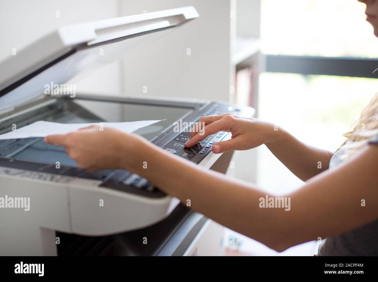 Girl using copier machine hi-res stock photography and images - Alamy