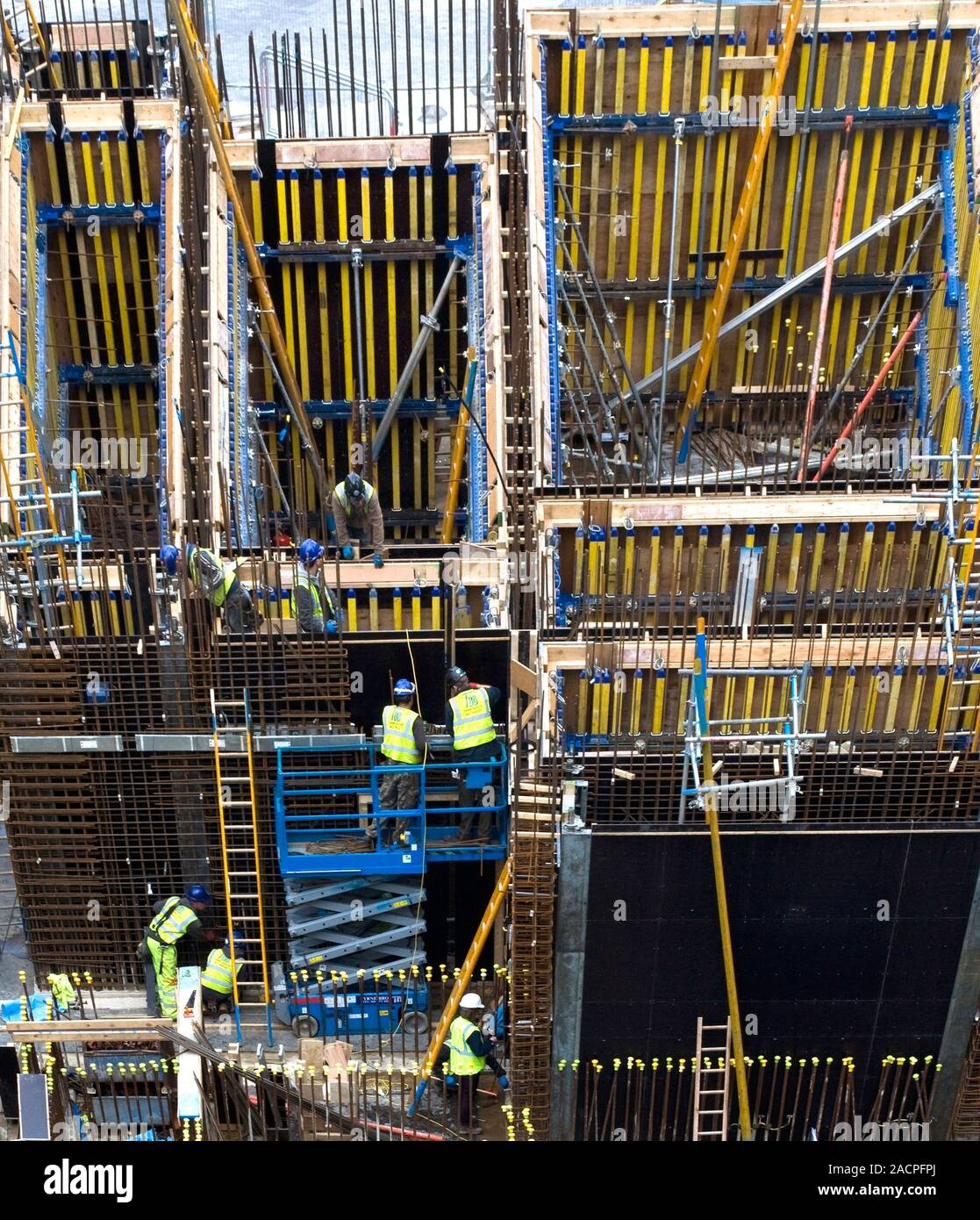 Construction site. Construction workers on a building site Stock Photo ...
