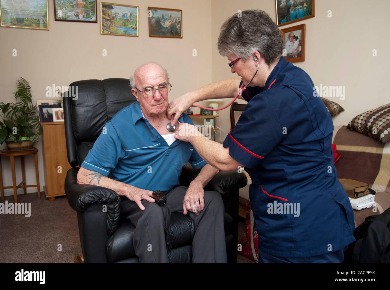 Community nursing. Advanced community nurse practitioner listening to ...