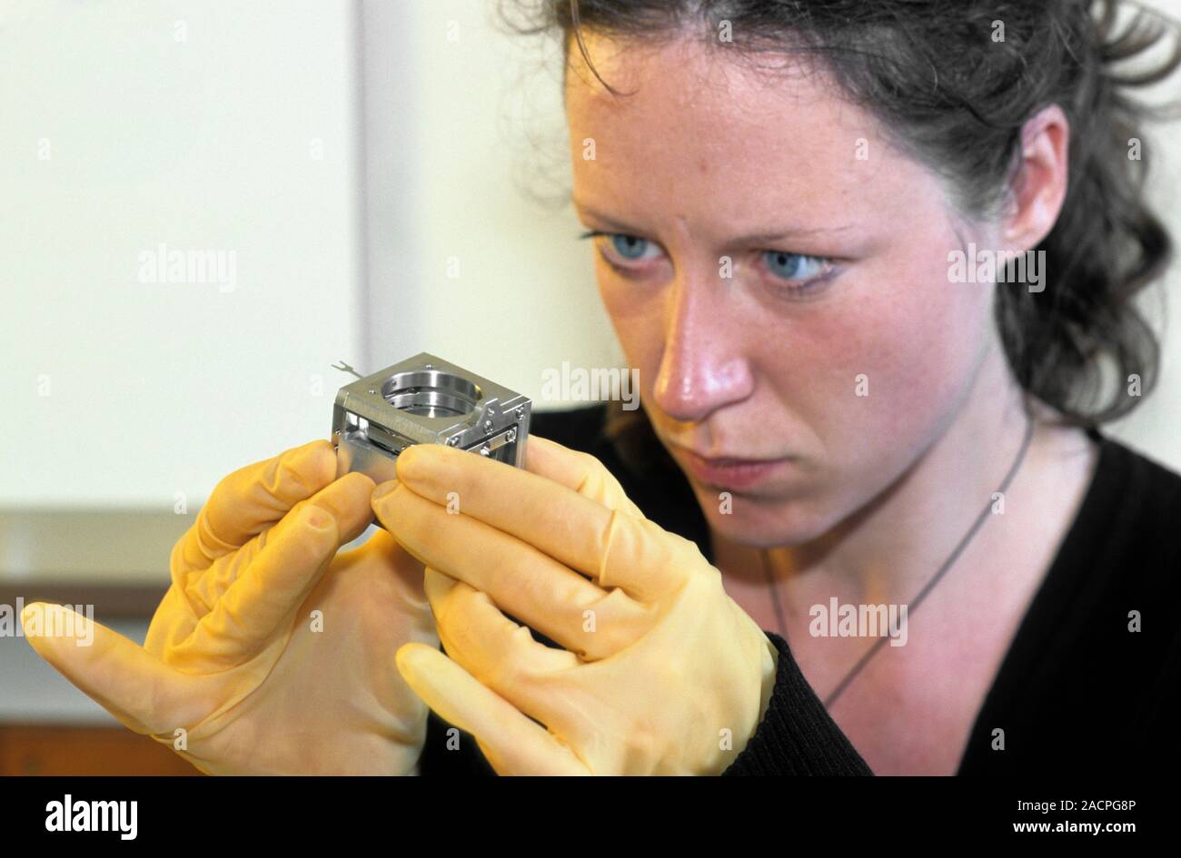 SPHINX instrument assembly. Technician assembling and adjusting the ...