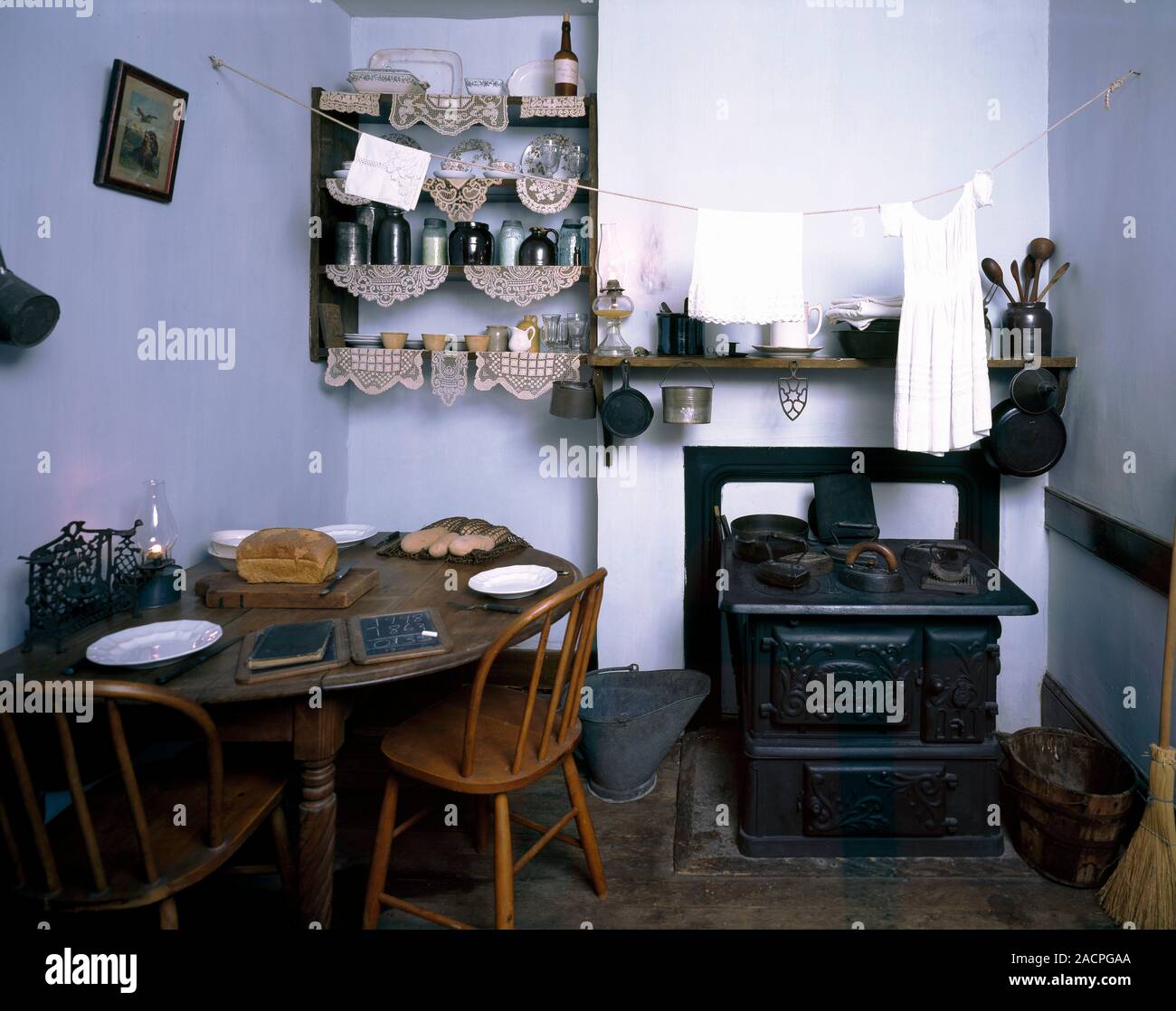 Tenement museum kitchen display. The stove, irons, and gas light (far ...