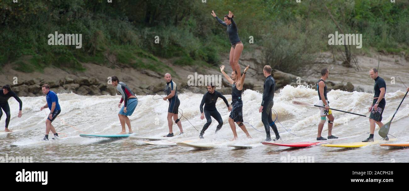 Surfers on the Garonne tidal bore, aerial photograph. Caused by the ...