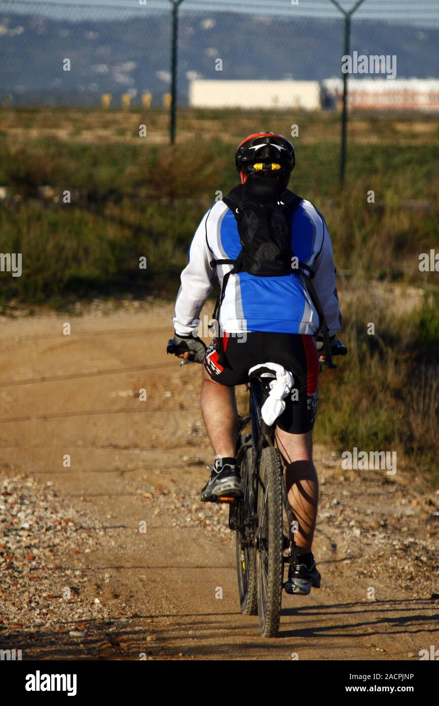 Man riding a bike Stock Photo - Alamy