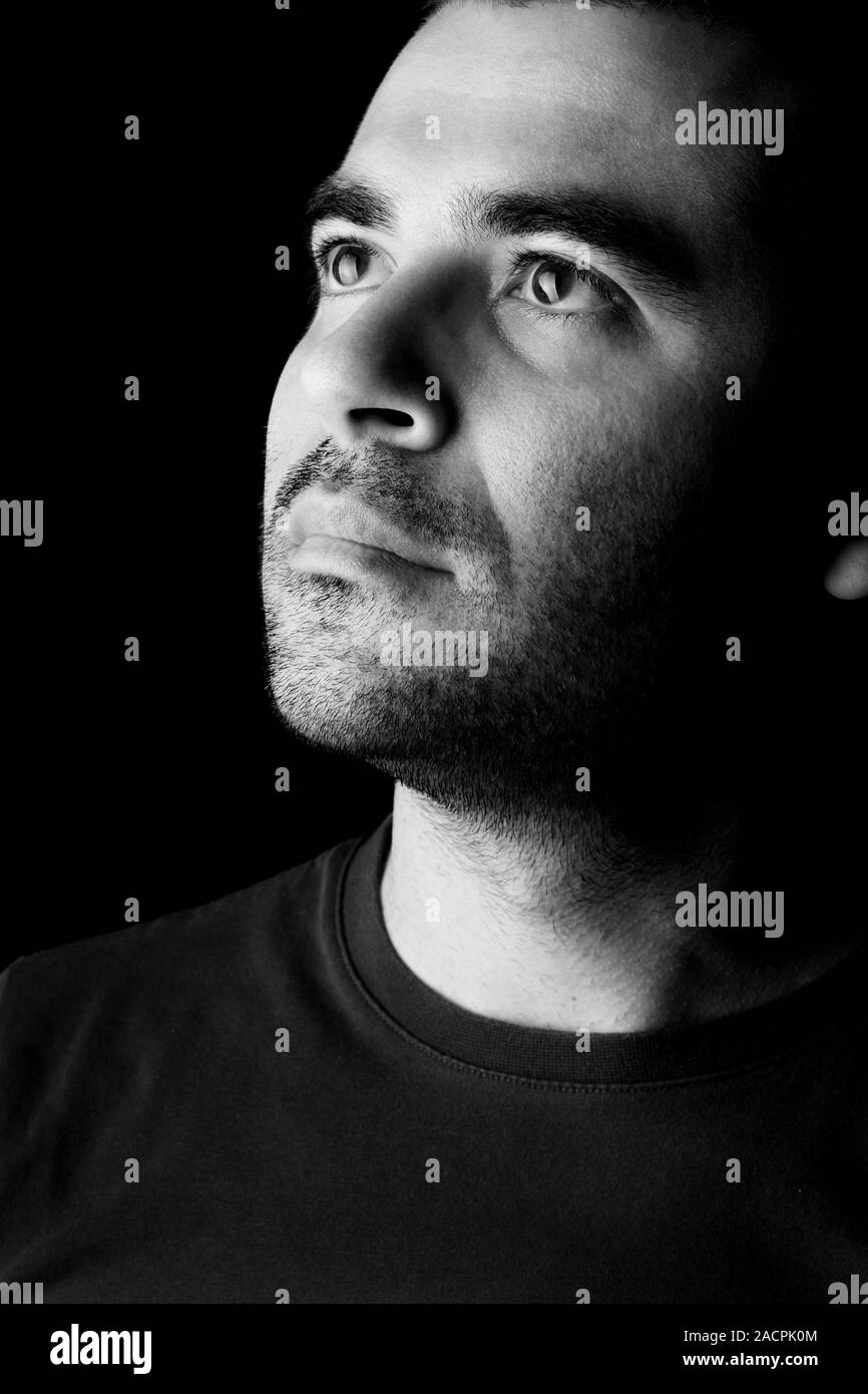 Man looking up black background Black and White Stock Photos & Images ...