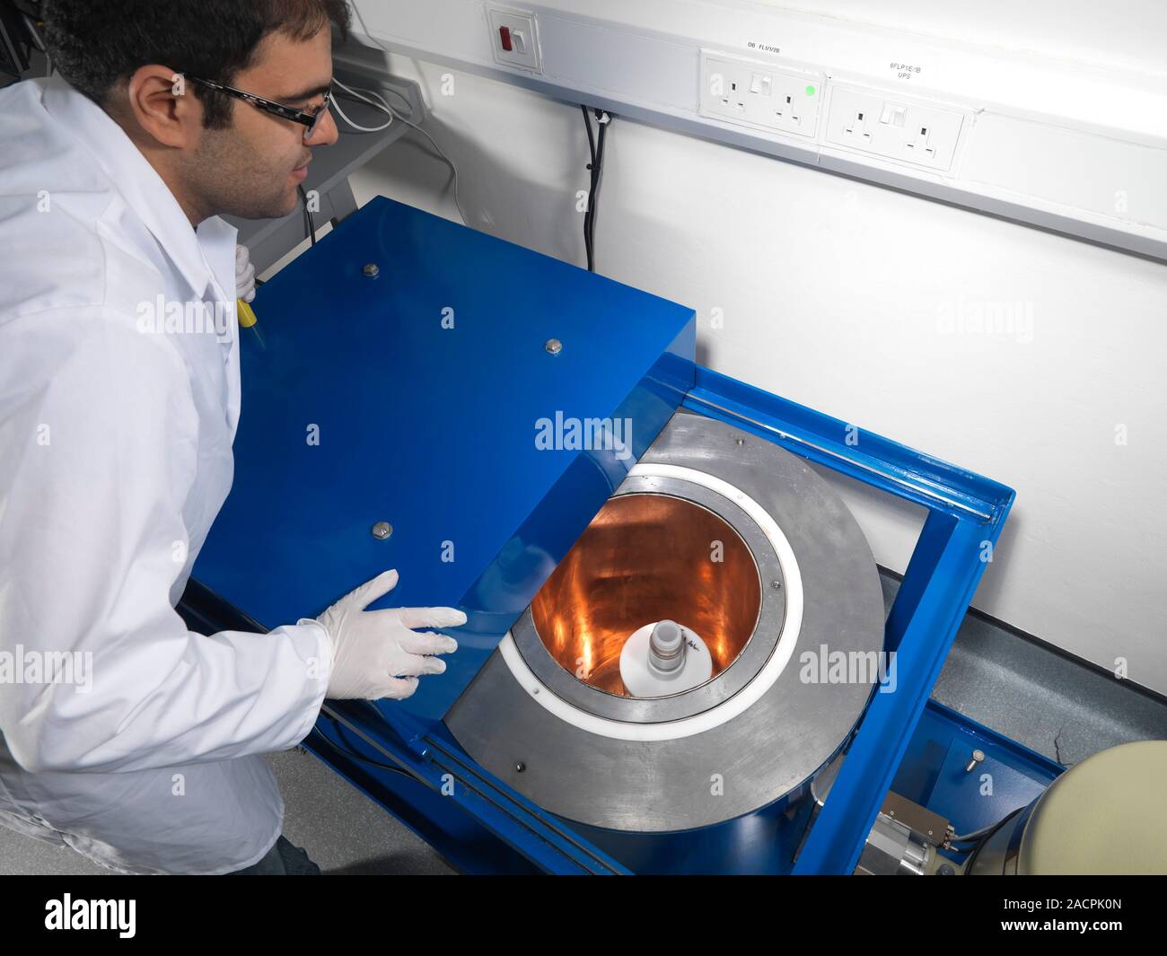 Gamma Spectroscopy Scientist Loading A Sample Into A Low Level Gamma Spectrometer The