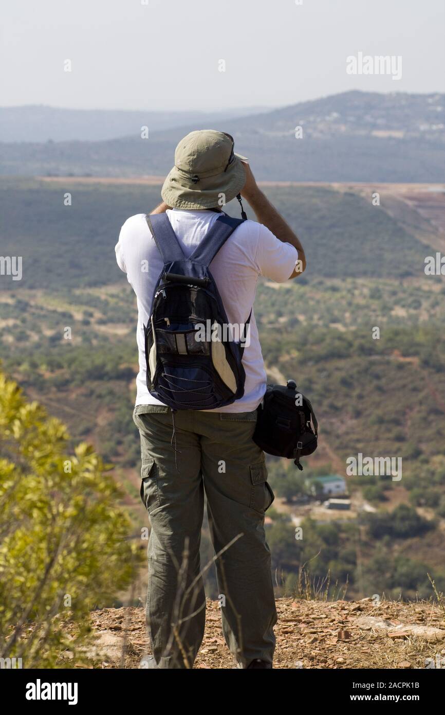 Explorer with binoculars Stock Photo - Alamy