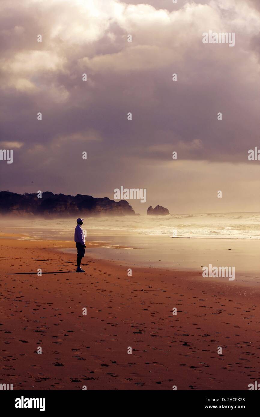 Man on beach Stock Photo - Alamy