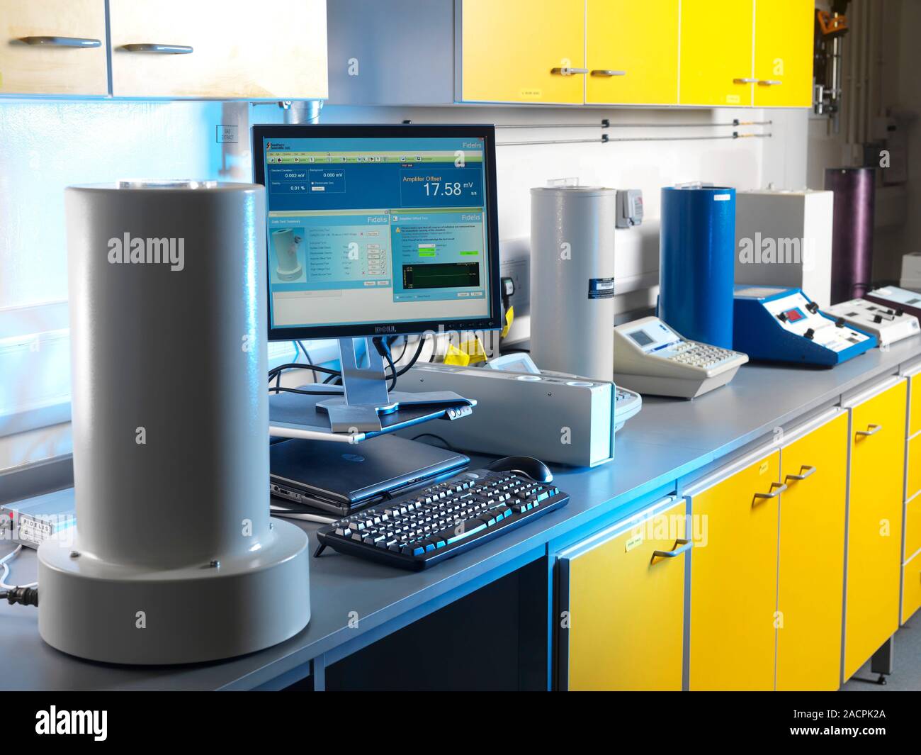 Ionisation chamber system (white, left) and viewing the resulting data ...