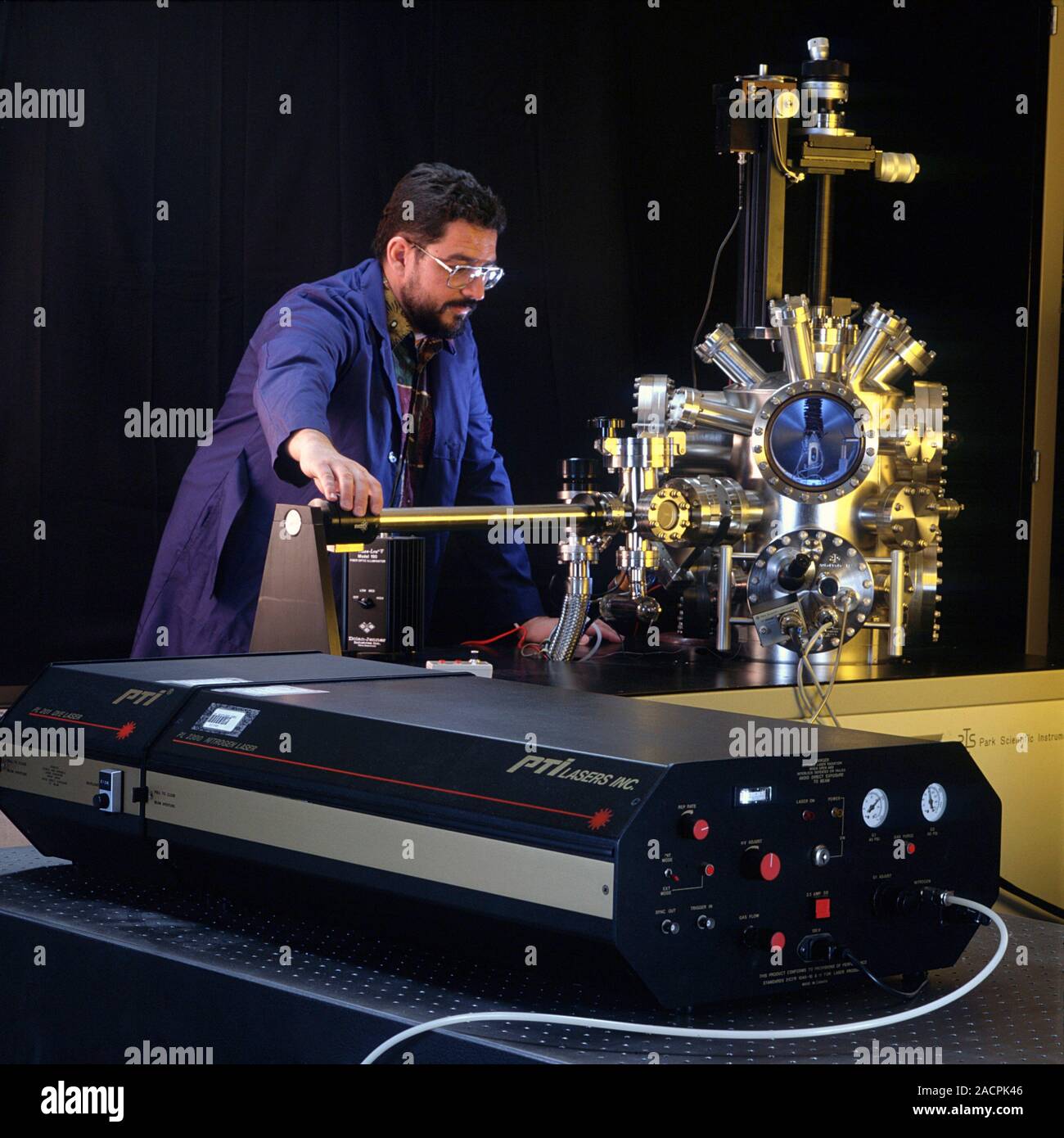 Atomic processing microscopy. Researcher operating an atomic processing ...