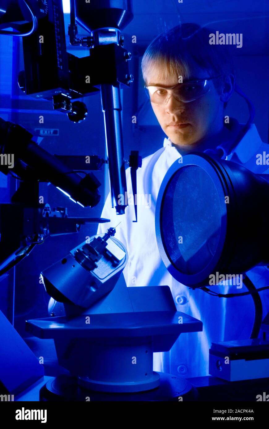 X-ray crystallography. Researcher using an X-ray machine to obtain ...