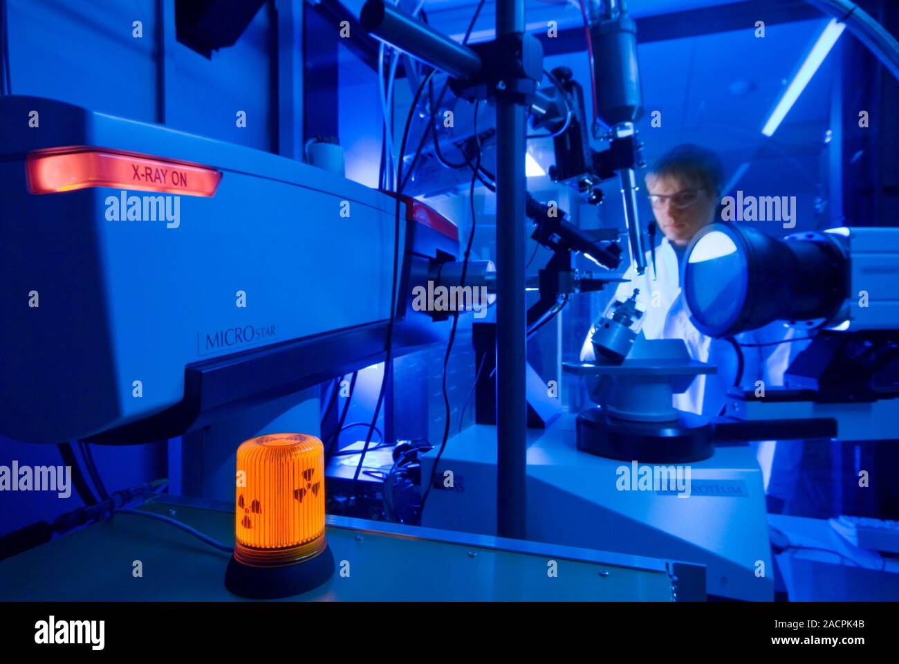 X-ray crystallography. Researcher using an X-ray machine to obtain ...