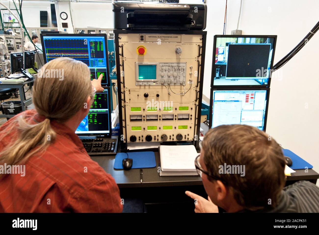 Rutherford backscattering spectrometry. Researchers working on ...