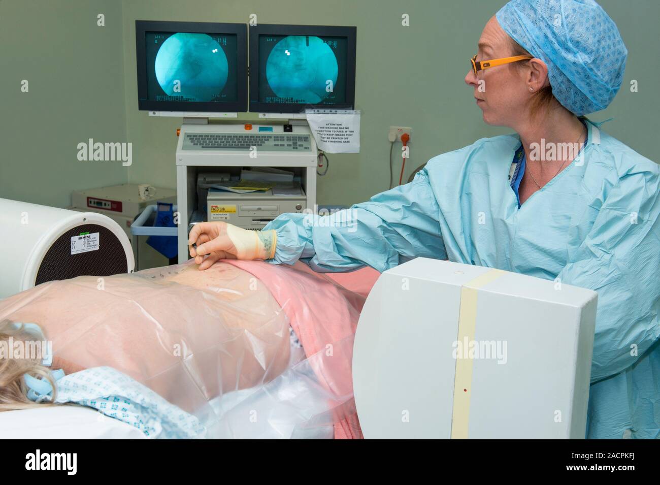 Lower back pain treatment. 60-year-old woman undergoing nerve root ...