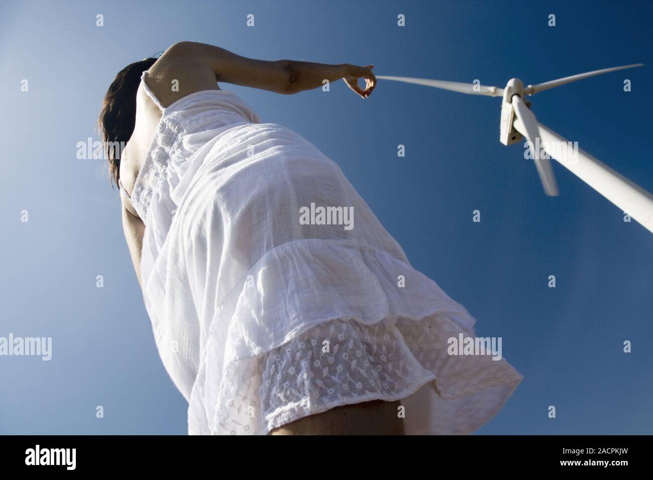 girl touching the windmill Stock Photo - Alamy