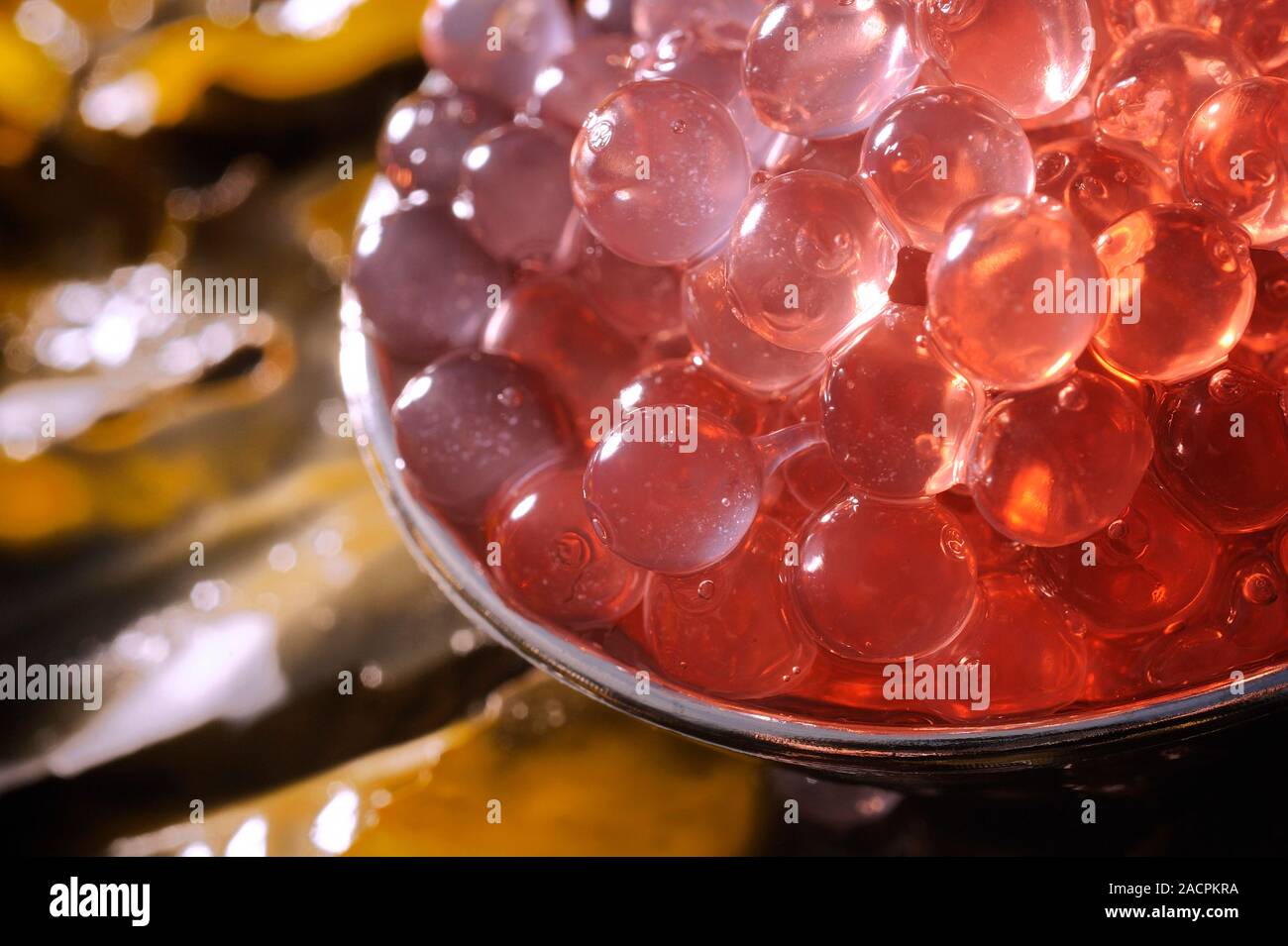 Sodium alginate beads. Close-up of sodium alginate beads produced for ...