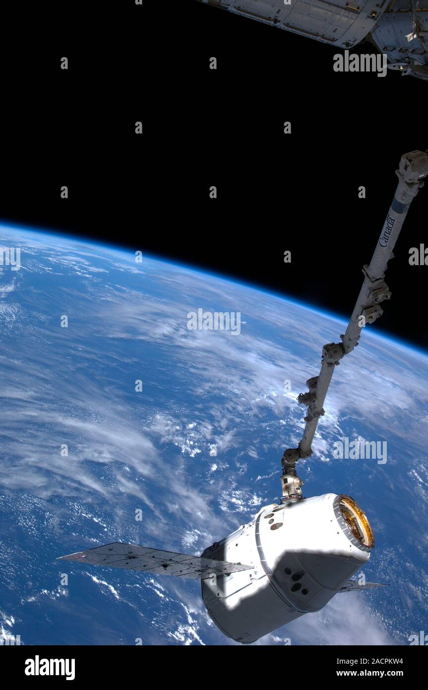 SpaceX Dragon capsule at the ISS. View from the International Space ...