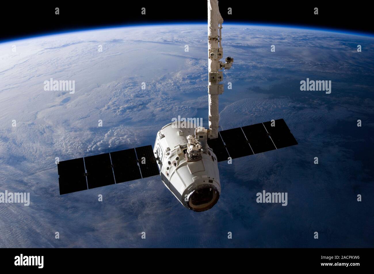 SpaceX Dragon capsule at the ISS. View from the International Space ...