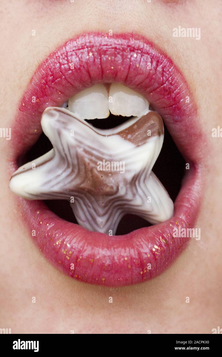 chocolate star on mouth Stock Photo - Alamy