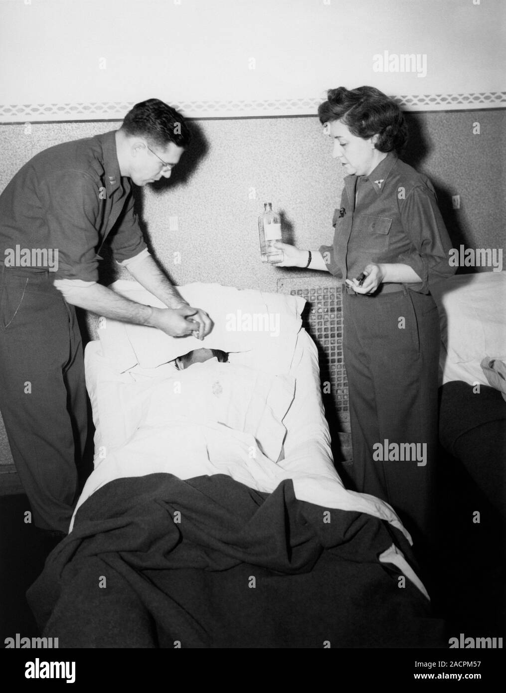 Penicillin injection. Doctor and nurse during World War II carrying out ...