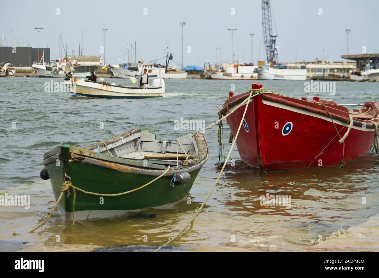 Row of anchored boats hi-res stock photography and images - Alamy