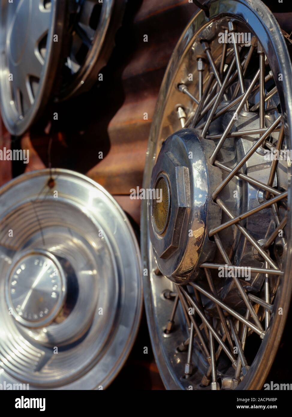 Chrome hub-caps hanging on a garage workshop wall. Hackberry, Mohave ...