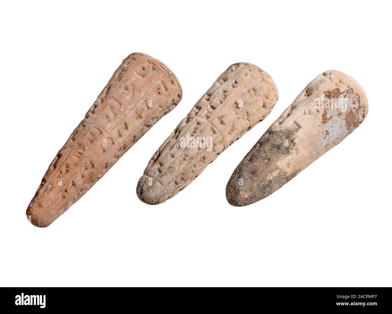 Clay nails inscribed with cuneiform script. Clay nails were inscribed ...