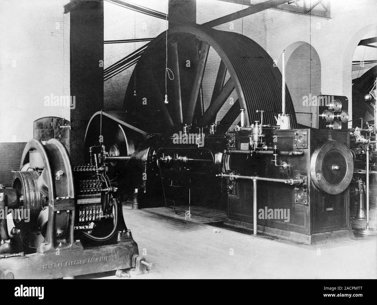 Corliss steam engine, circa 1900. This view shows the engine's dynamo ...