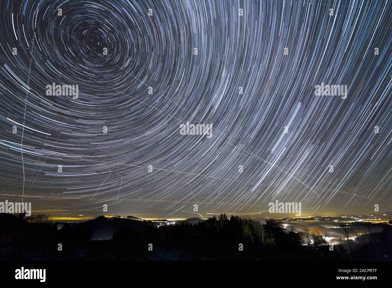 Star trails and aeroplane trails. Star trails are formed by the ...