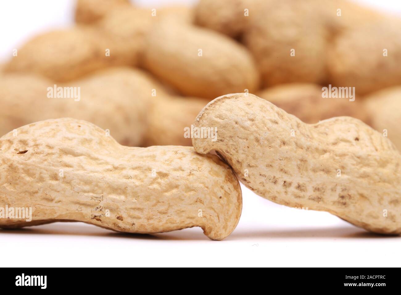 Backgroun of the two peanuts Stock Photo - Alamy