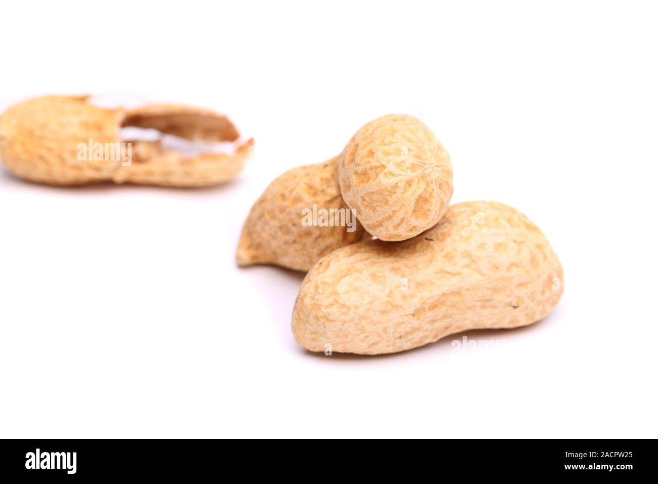 Three peanuts in closeup and peel Stock Photo - Alamy