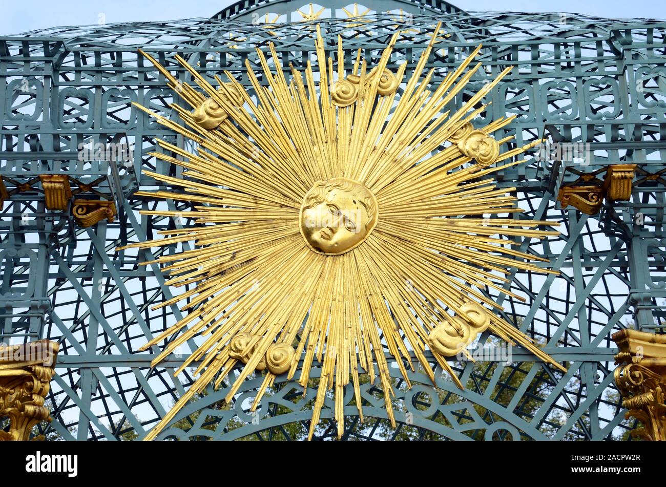 Golden sun symbol. 18th-century golden sun symbol in the Sanssouci, a ...