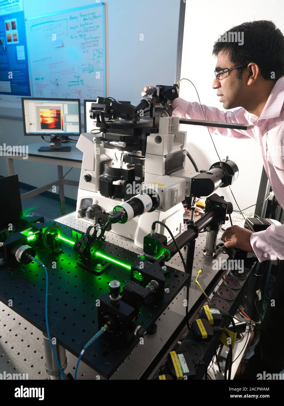 Laser microscope experiment. Researcher working in a laboratory on an ...