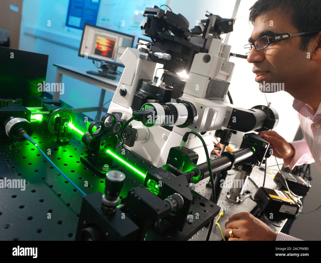 Laser microscope experiment. Researcher working in a laboratory on an ...