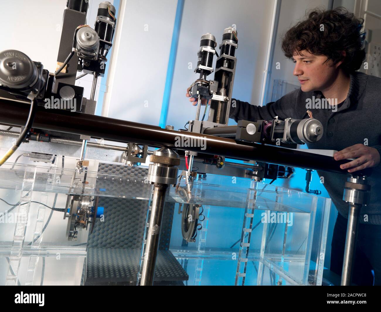 Ultrasound beam plotting tests. Researcher carrying out tests with ...