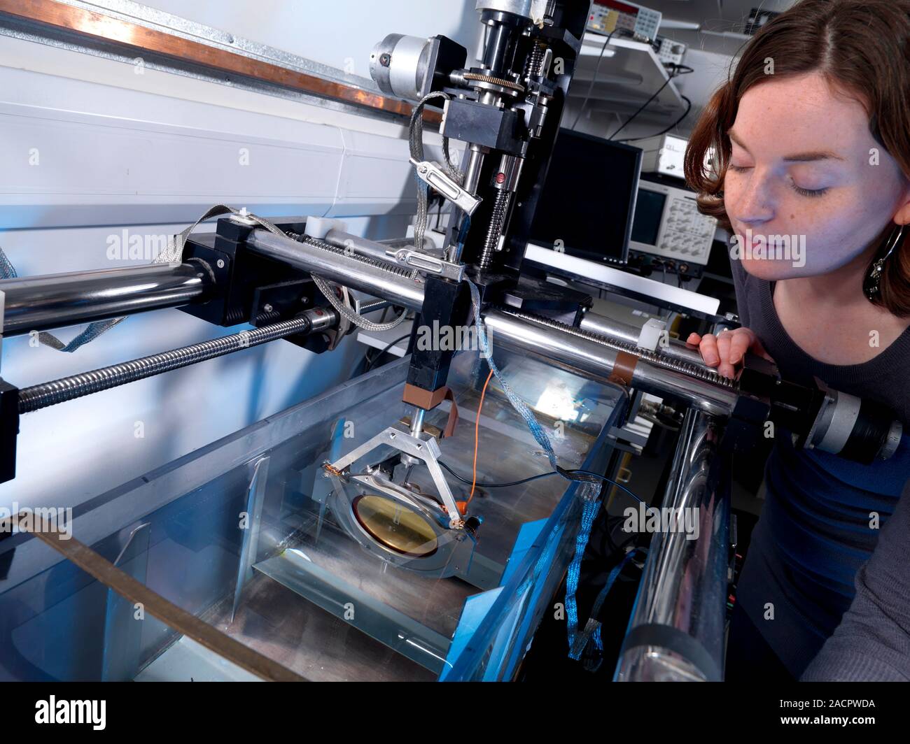 Ultrasound hydrophone calibration test. Researcher using equipment to ...