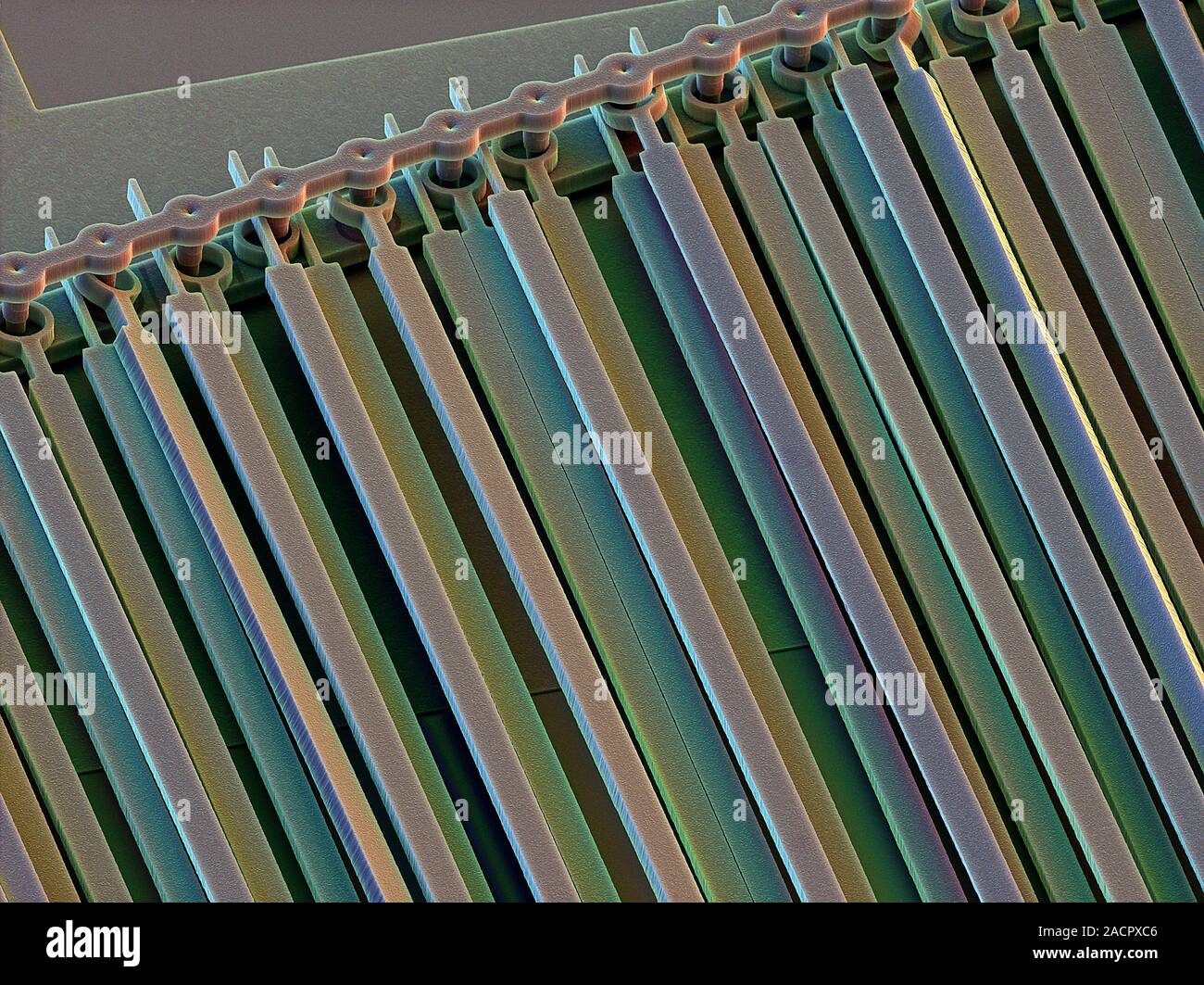 MEMS nanophotonic filter. Coloured scanning electron micrograph of the ...