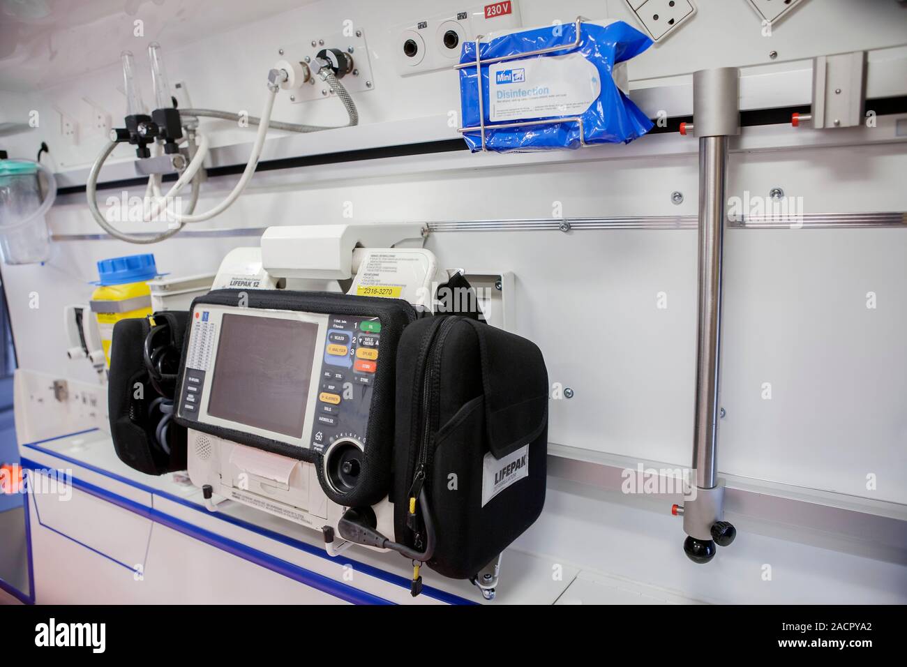 Ambulance interior. Electrocardiogram (ECG) equipment inside an ...
