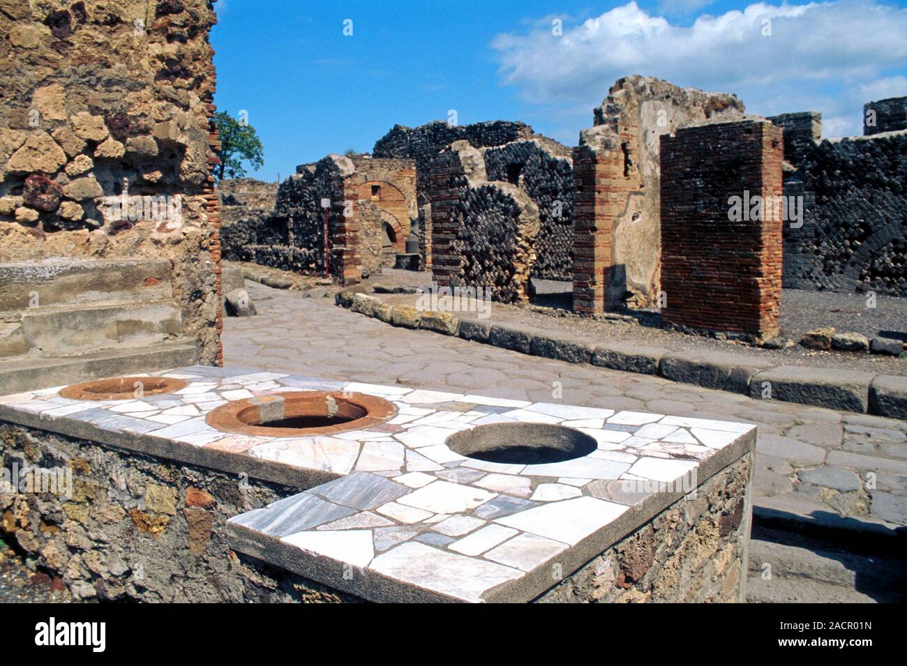 Pompeii thermopolium. View of the remains of the thermopolium in the ...