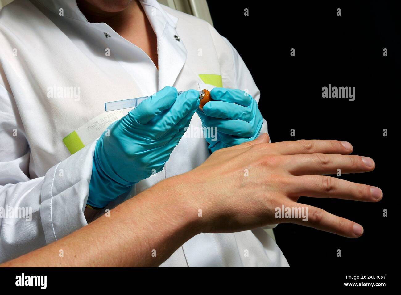 Forensic gunshot residue analysis. Forensic scientist using special ...