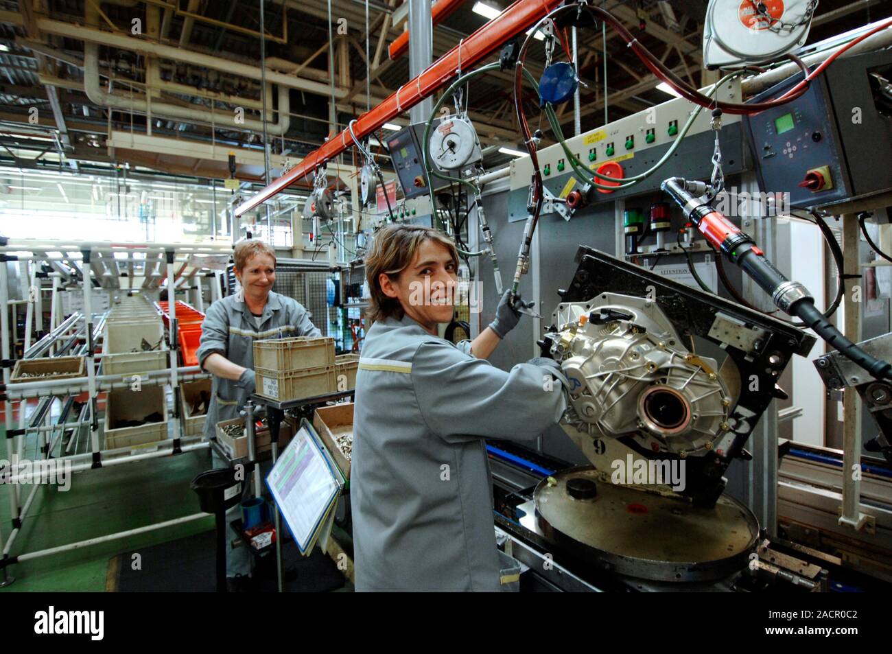 Car spare parts factory. Workers in the Renault spare parts factory ...