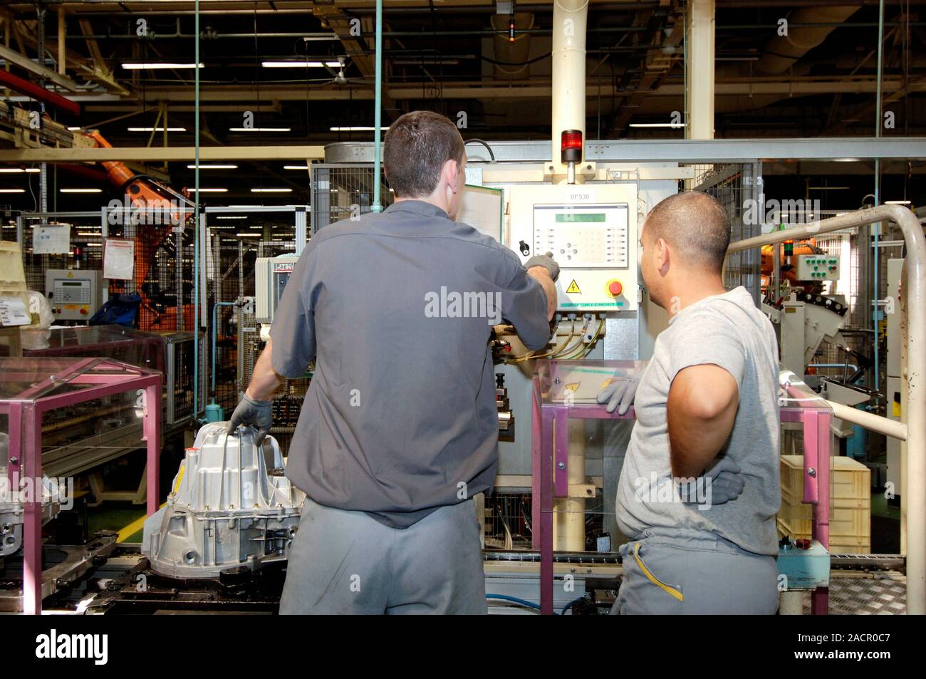 Car spare parts factory. Workers in the Renault spare parts factory ...