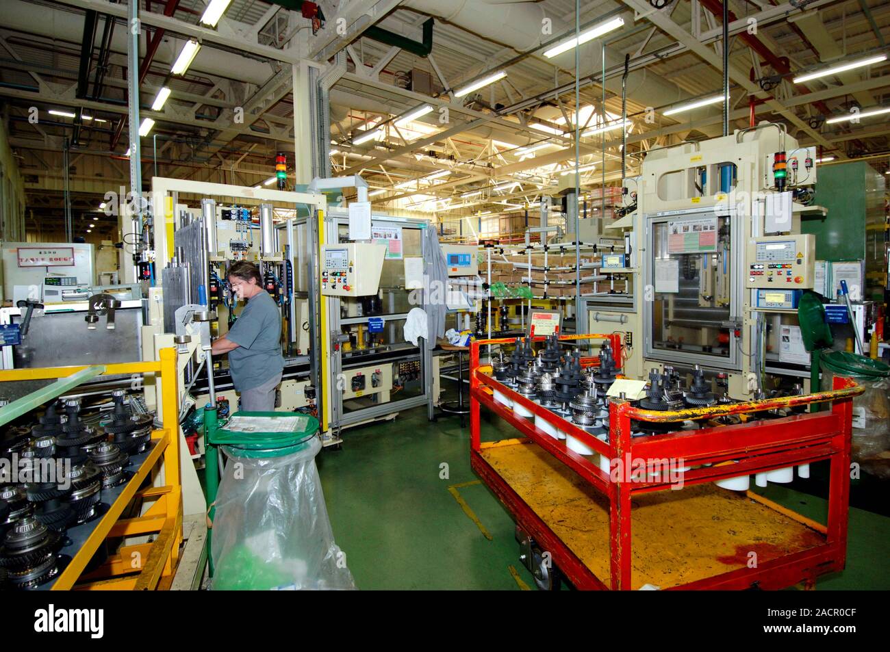 Car spare parts factory. Worker in the Renault spare parts factory ...
