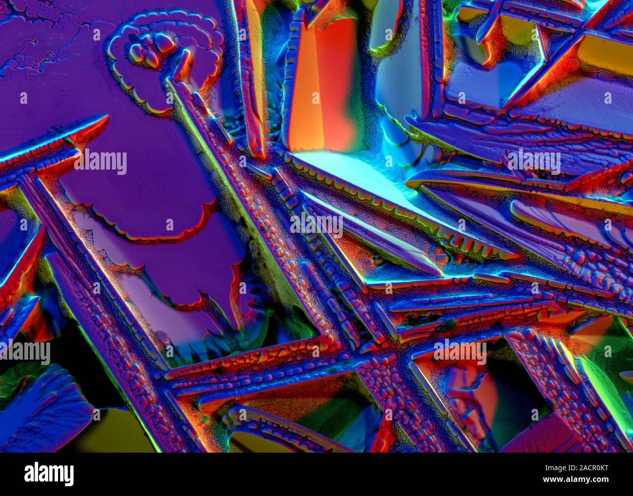 Molten and recrystallised metal. Coloured scanning electron micrograph ...