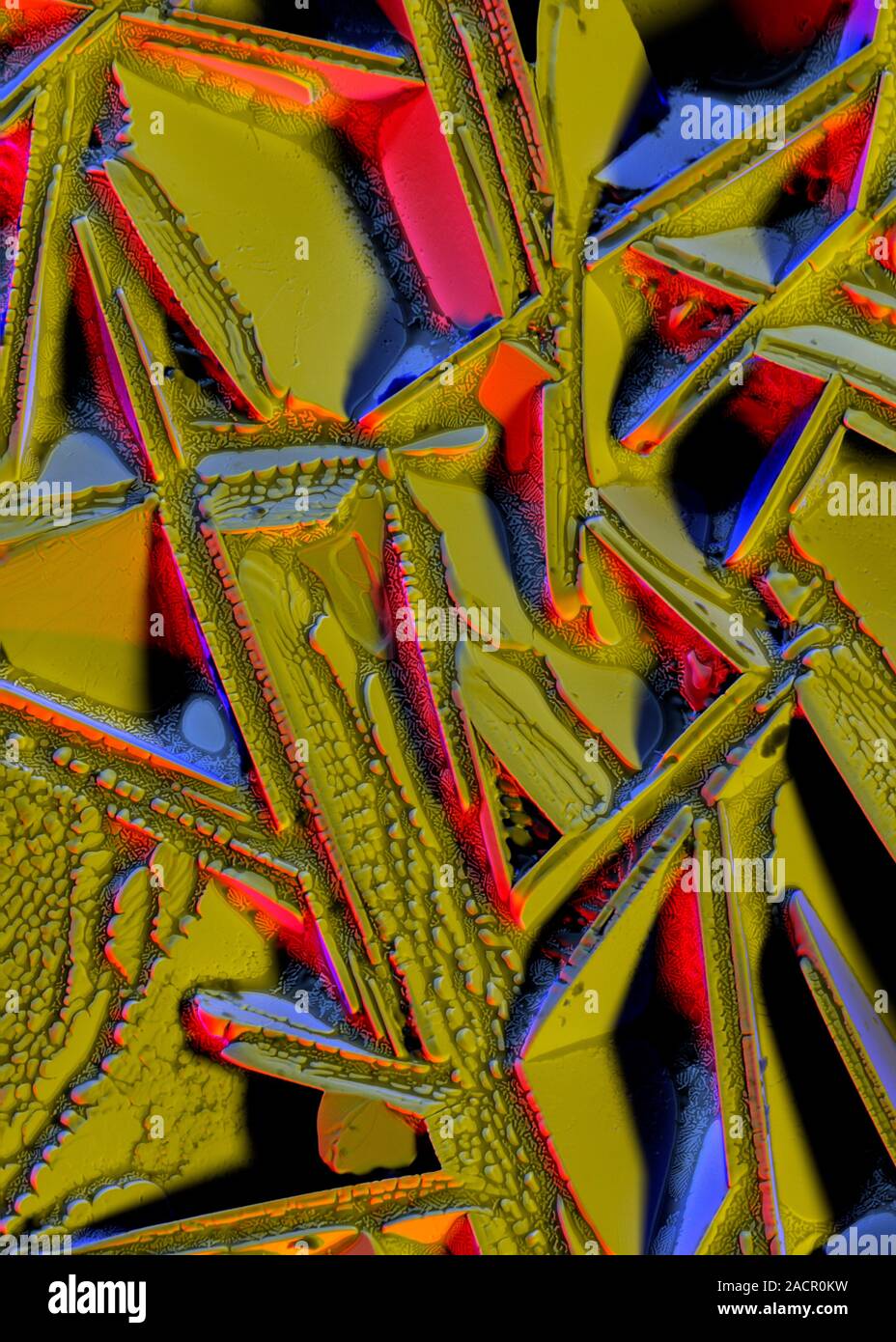 Molten and recrystallised metal. Coloured scanning electron micrograph ...