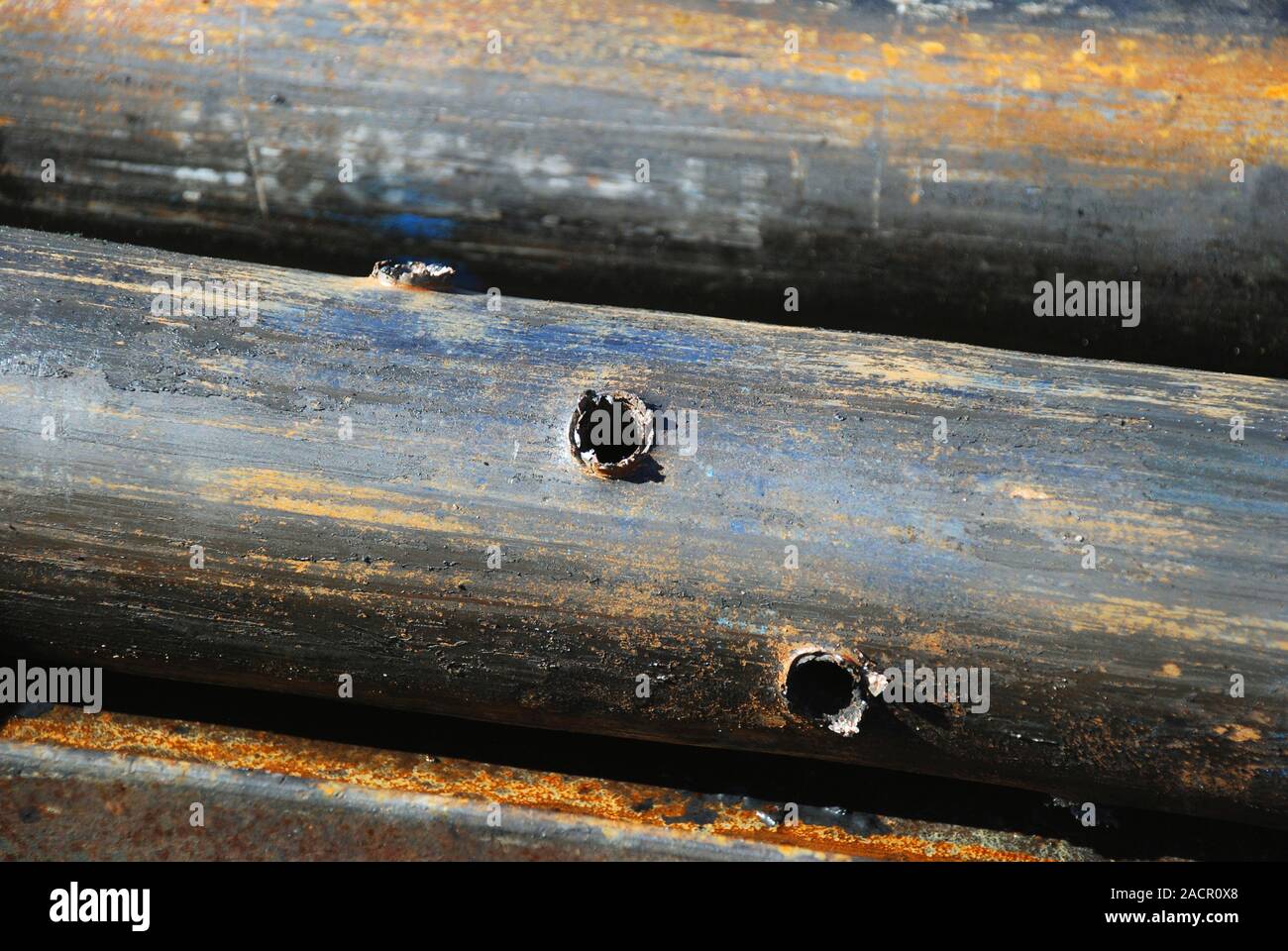Fracking perforating gun. Close-up of the holes in a perforating gun ...
