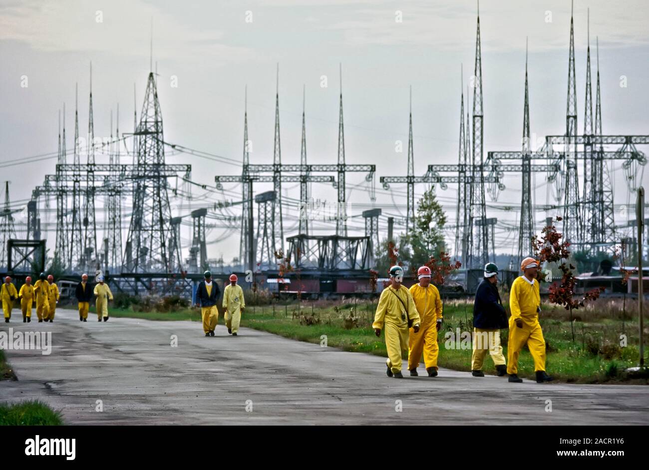 Chernobyl disaster shelter maintenance. Workers on their way into the ...