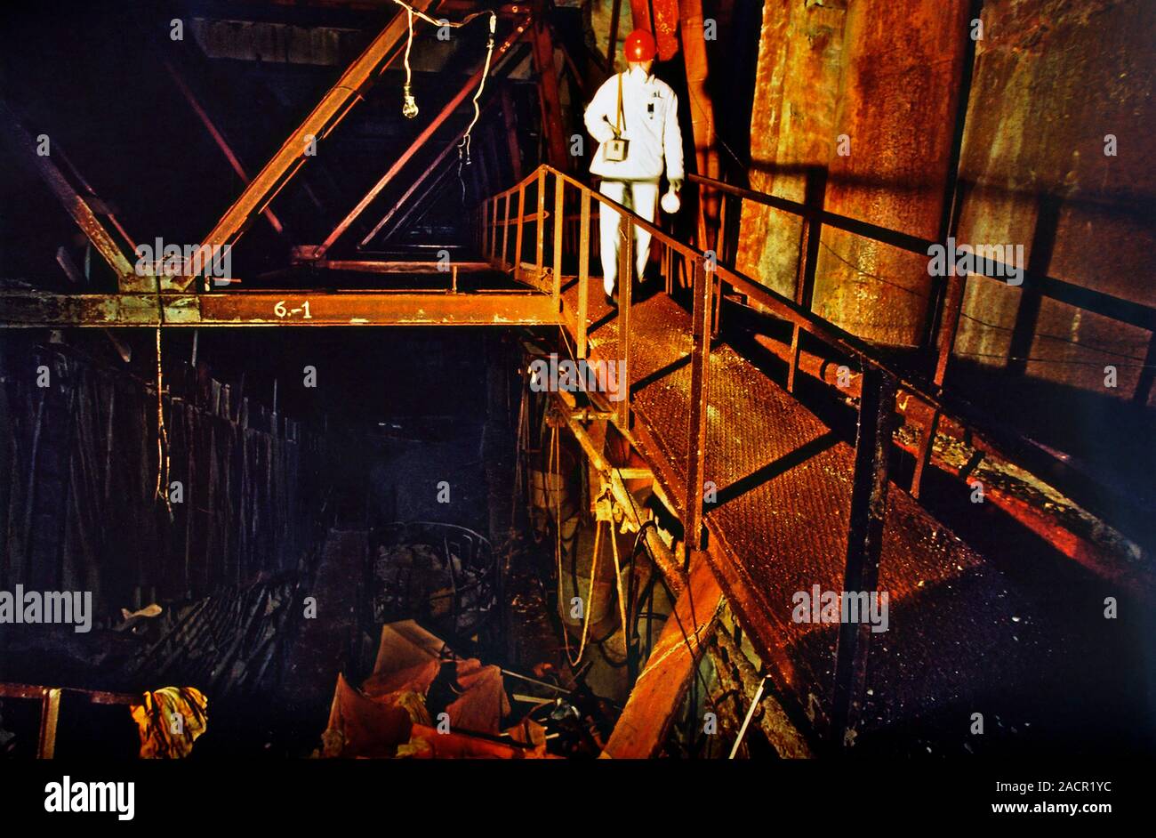 Chernobyl disaster shelter maintenance. Worker measuring radiation ...