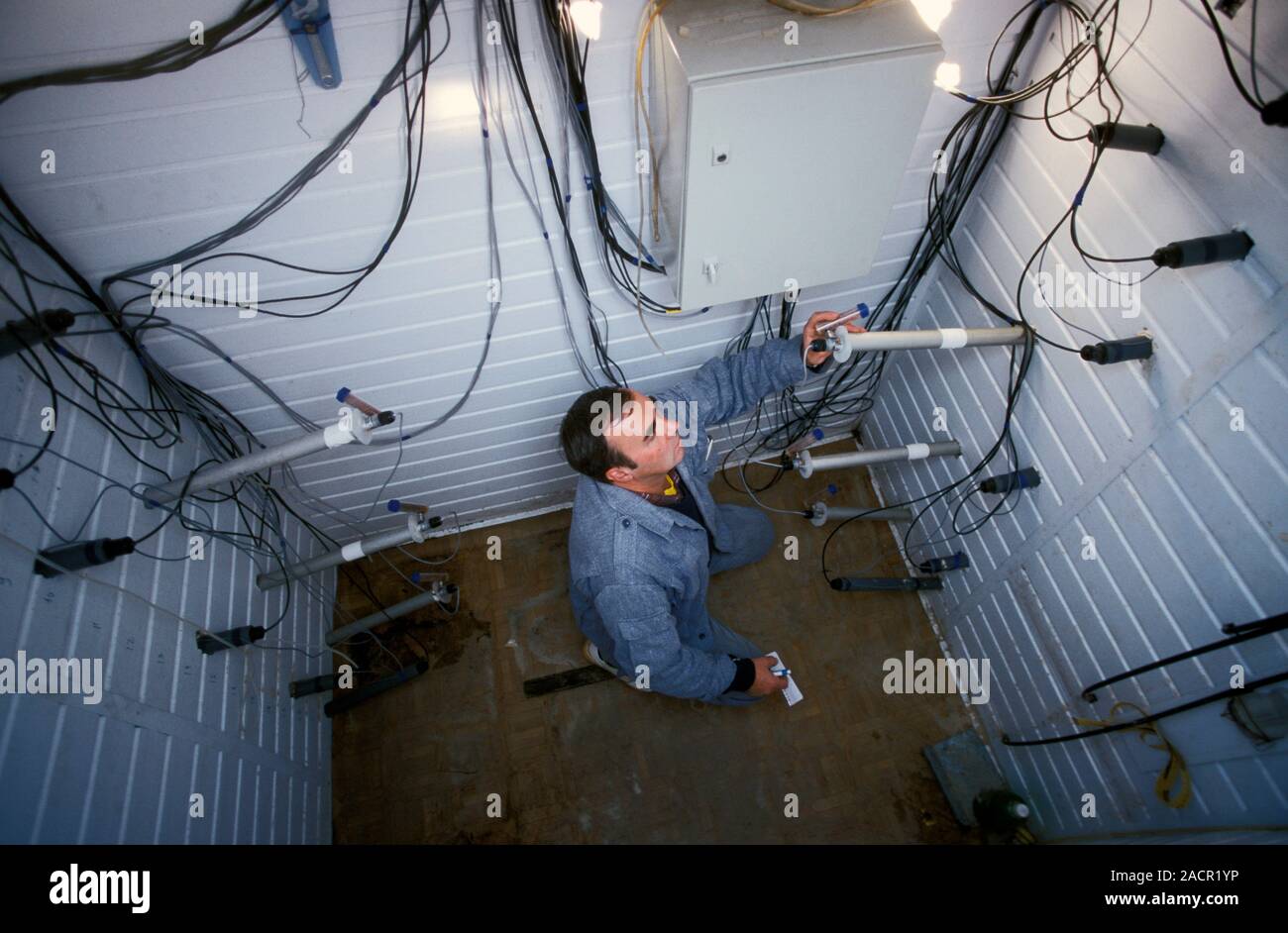 Chernobyl disaster environmental research. Researcher checking probes ...