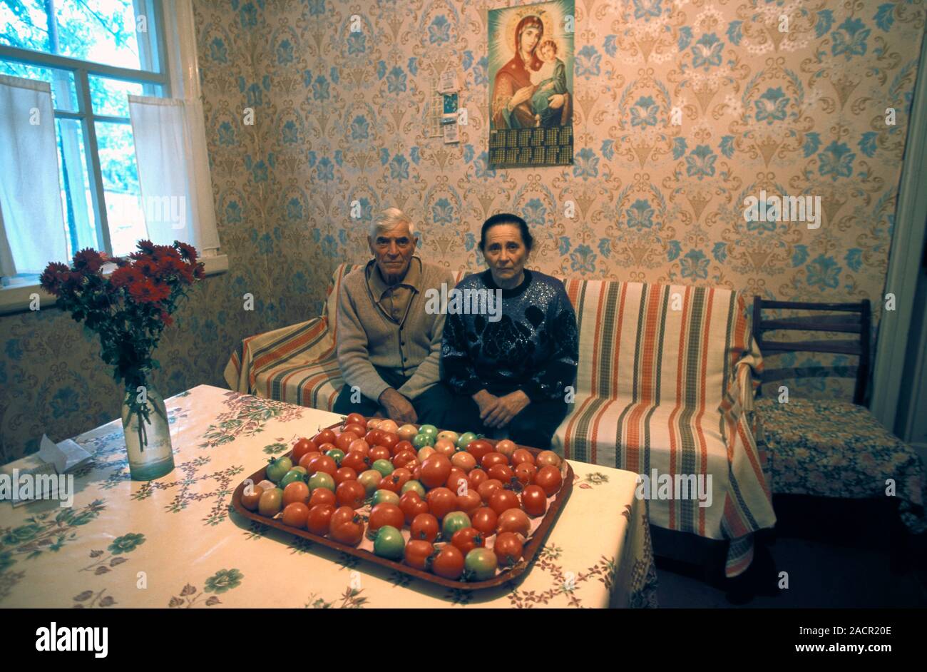 Chernobyl exclusion zone inhabitants. Husband and wife in their living ...