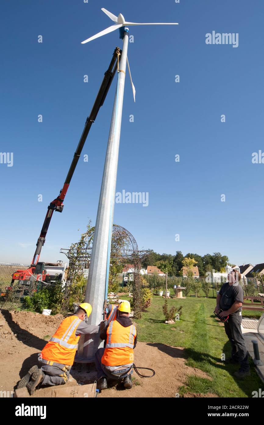 Wind turbine installation. Workers erecting a wind turbine Stock Photo ...